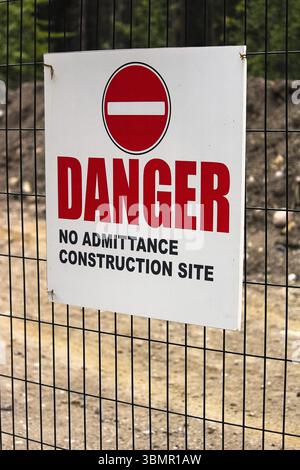 an attention construction site sign, trespass forbidden for non ...