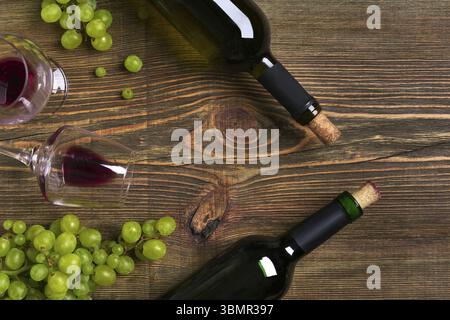 A wooden table with several glasses and bottles in an outdoor cafe ...