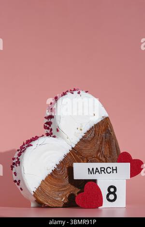 Chocolate and heart shaped sweets. Trendy pink feathers and purple ...