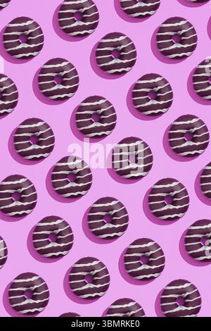 Food design with tasty chocolate glazed donut with white strips on ...