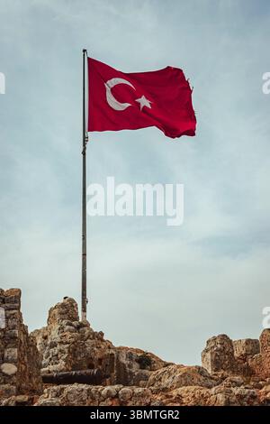 Turkish flag. Waving flag of Turkiye on blue sky background. National ...
