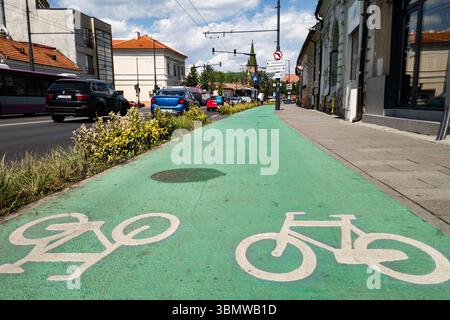Cluj-Napoca, Romania - 25th Jun, 2025: A two-way green bicycle track ...