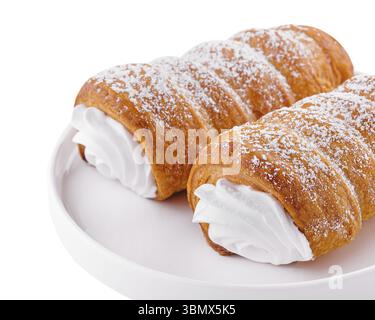 food still-life, Baked tubules with whipped cream on plate Stock Photo ...