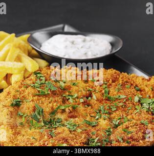 Fried wiener schnitzel from veal topside with french fries Stock Photo ...