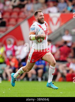 St Helen's Daryl Clark breaks away to score their fifth try during the ...