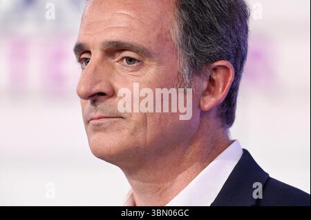Grenoble mayor Eric Piolle poses for pictures ahead of an interview for ...
