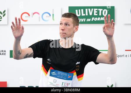 Florian Wellbrock of Germany, gold, attends the medal ceremony of the ...