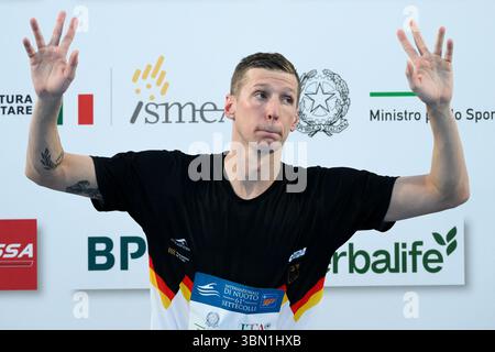 Florian Wellbrock of Germany, gold, attends the medal ceremony of the ...
