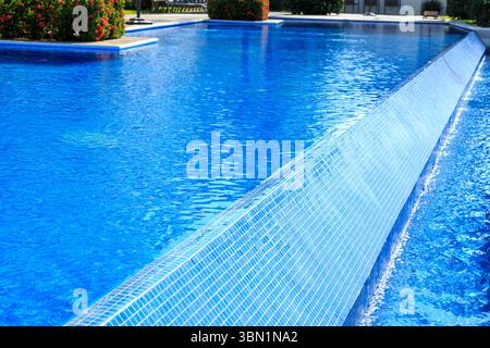 Detail of tile-work and flowing water in a swimming pool Stock Photo ...