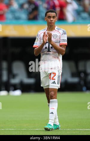 Jamal Musiala (FC FC Bayern Munich, #10) warming up before the game ...
