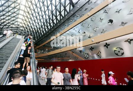Tourists visit the world's only giant wheel-shaped building of French ...