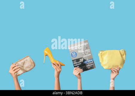 Female hands with magazine, high heel and stylish bags on grey ...