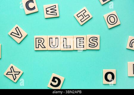 Word RULES with letters on turquoise background Stock Photo - Alamy