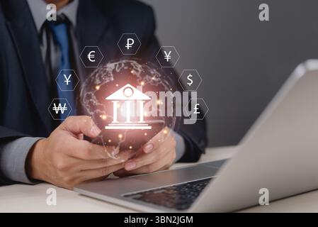 Businessman holding currency symbols concept Stock Photo - Alamy