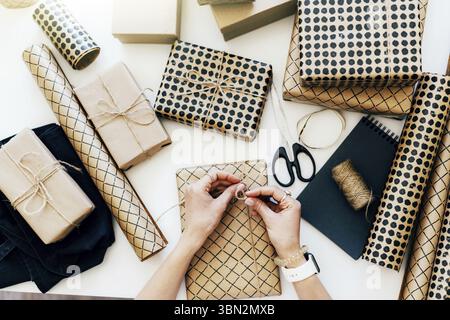 Top view of a person wrapping gifts for the holiday season Stock Photo ...