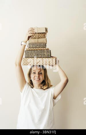 one craft wrapped gift over red background Stock Photo - Alamy