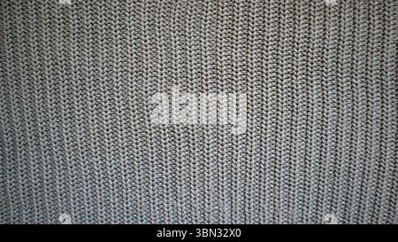 Banner made with gray knitted sweater, wooden knitting needles and ice ...