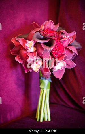 A lush bouquet of fresh red roses. Flower composition on light pastel background. Festive card ...