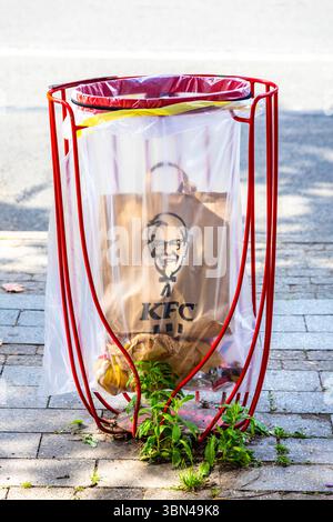 Bag with garbage and rubbish bin with logo of recycling at home Stock ...