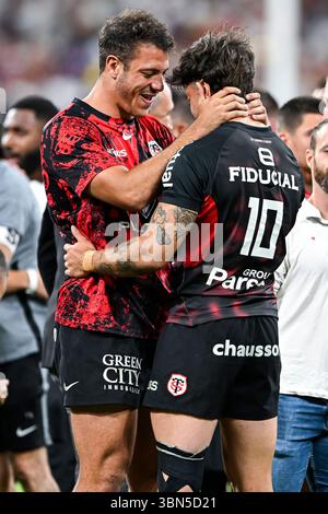 Romain Ntamack of Stade Toulousain and Theo William of Lyon during the ...