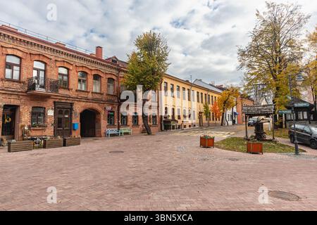 Minsk, Rakovskaya street. Old brick house with balconies. Shop on the ...