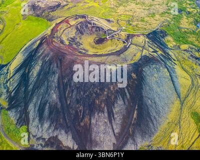 Aerial drone view of the Grabrok Volcano crater in Iceland during ...