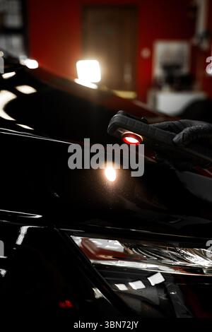 Car paint inspection using detailing inspection light before polishing ...