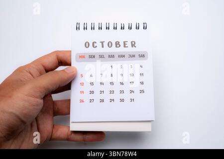 hand holding desk calendar showing july month Stock Photo - Alamy