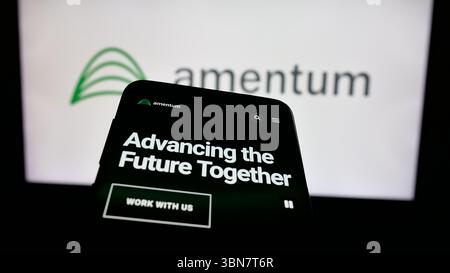 In this photo illustration, the Amentum logo is seen displayed on a ...