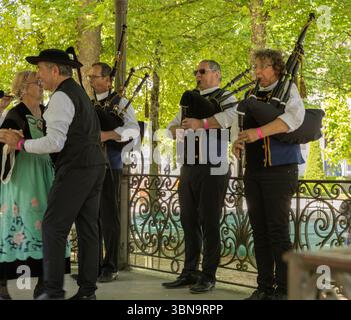 Bagpipe players and traditional folk dancers exhibit their skills on ...