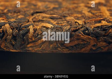 Puer tea displayed on a surface, showcasing its unique texture and ...