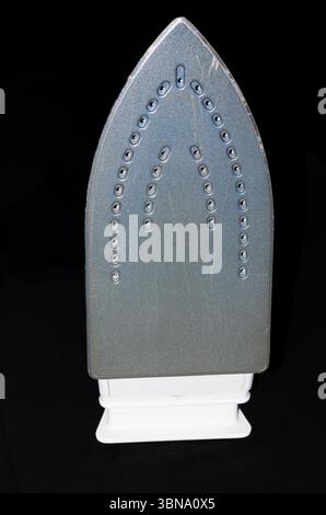 Steam iron isolated on black Stock Photo - Alamy