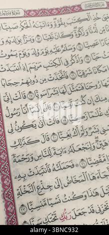 Ramadan concept photo. Praying muslim man with Holy Quran in the mosque ...