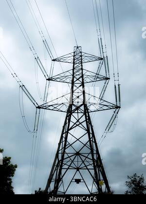 Low-angle shot of power lines against the cloudy sky Stock Photo - Alamy