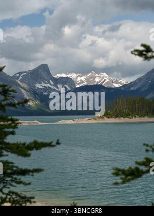 A forested mountain under a cloudy sky Stock Photo - Alamy