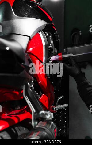 Precision oil fill operation on a red sportbike to ensure proper engine ...