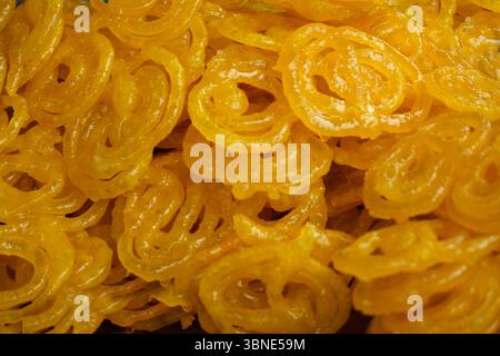 Jalebi is a famous indian sweet. frying sweets jalebi in oil, indian ...