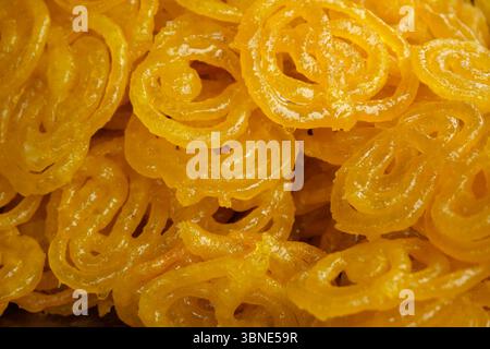 Jalebi is a famous indian sweet. frying sweets jalebi in oil, indian ...