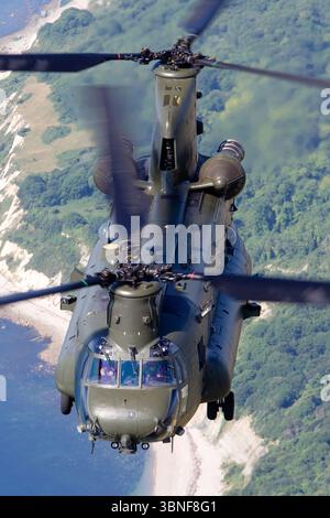 A Chinook helicopter in flight demonstrates its heavy-lift capability ...
