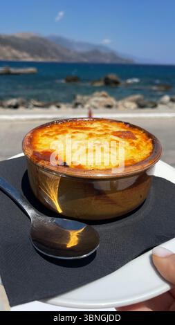 Greek moussaka on white plate Stock Photo - Alamy