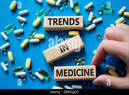 Wooden block with symbol of trends concept on blue background Stock ...