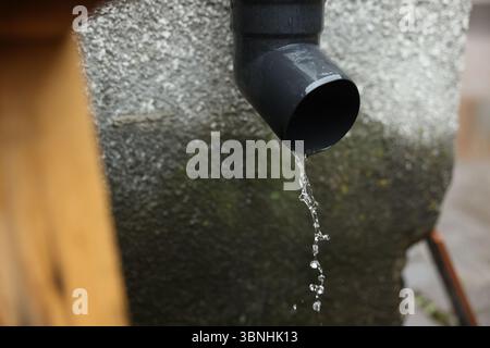 Water dripping from drain pipe outdoors, closeup Stock Photo - Alamy