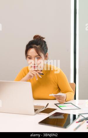 Female UI UX Designer Creating Mobile App Screen Flow From Laptop Stock ...