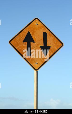 Yellow Two-Way Direction Sign with the Words Clever and Beautiful on ...