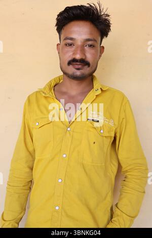 Expressive man in black neat jacket actively gesturing Stock Photo - Alamy