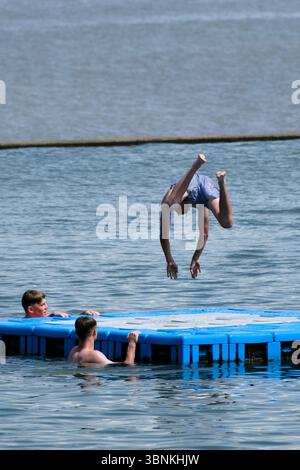 Swimmers enjoy a cooling dip in the Peterborough Lido as the prolonged ...