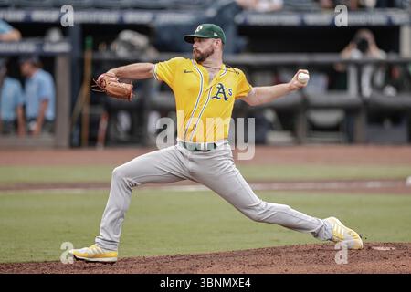 Athletics pitcher Hogan Harris (36) throws during the ninth inning of a ...