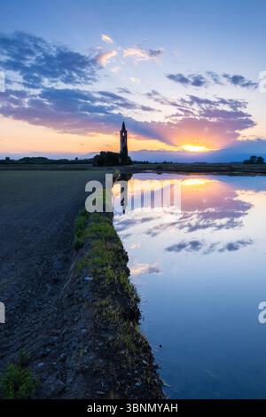 Sunset over the rice fields and abandoned church of Sant'Antonio ...