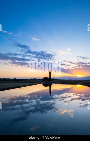 Sunset over the rice fields and abandoned church of Sant'Antonio ...