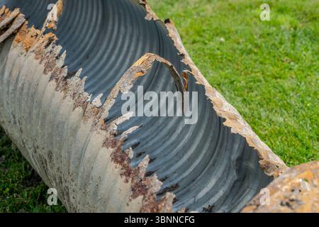 Infrastructure photo of rusted out corrugated metal pipe, CMP, drainage ...